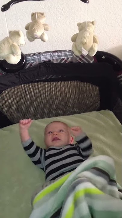 Liam Watching the Mobile in his Portable Crib - YouTube