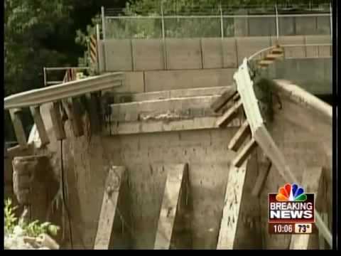 Flooding punches 30-foot hole in dam - YouTube