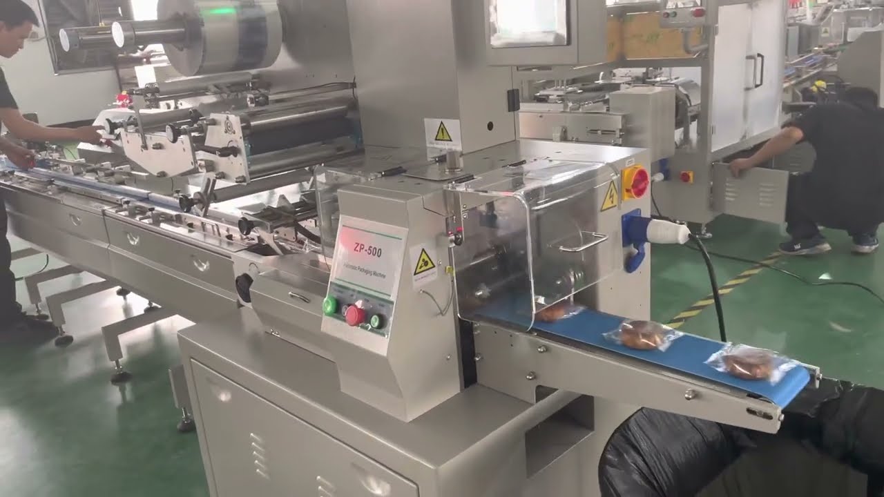 The automatic food packaging machine is flow packaging system for food ...