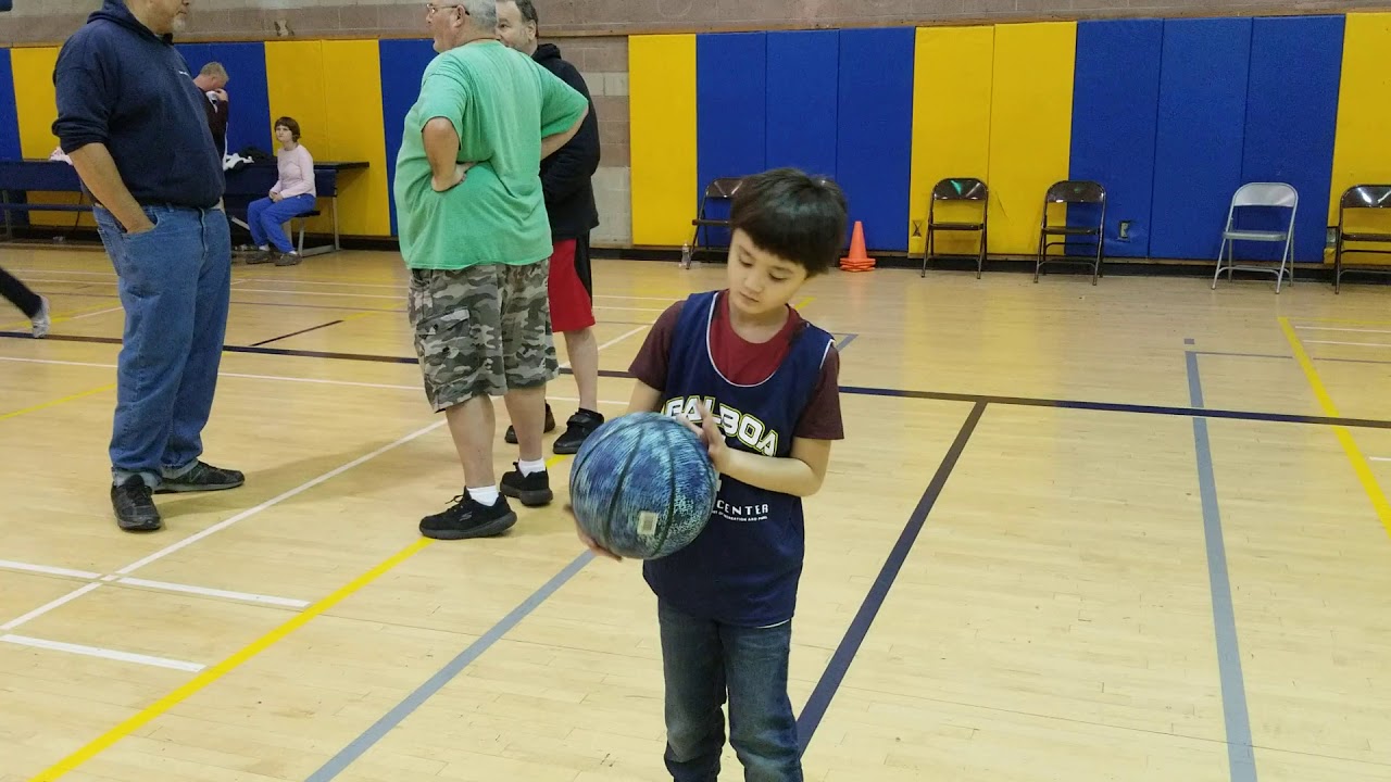 8 year old with autism handles a basketball - YouTube
