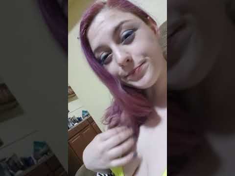 Girl in lime green bikini eating brussel sprouts
