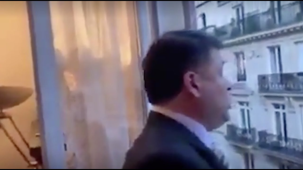 A French opera singer performs the national anthem from his balcony ...