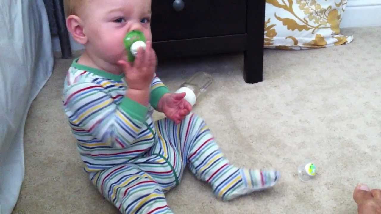 Baby Logan switches pacifiers - YouTube