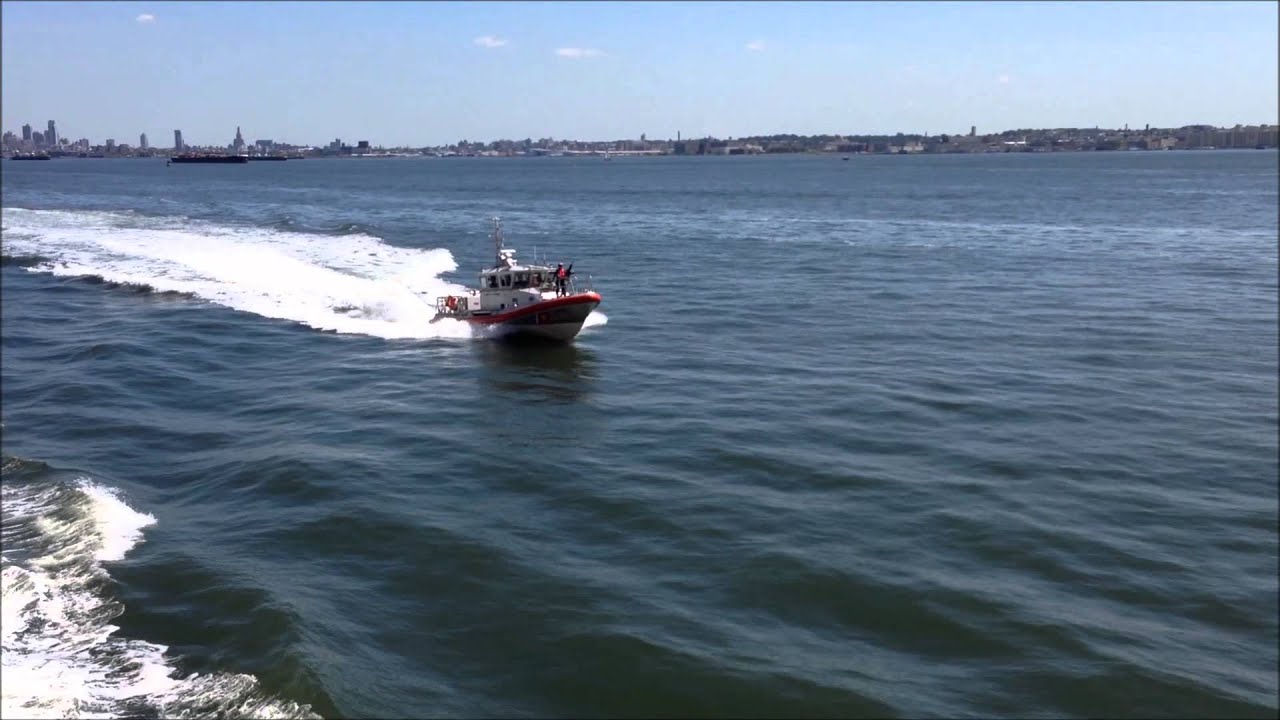 UNITED STATES COAST GUARD PATROL UNITS ON NEW YORK HARBOR ESCORTING THE ...