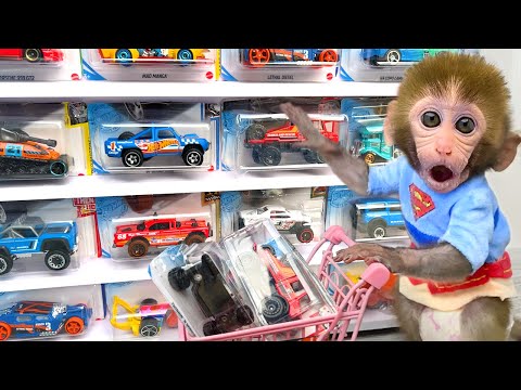 Monkey Baby Bon Bon doing shopping in Hot Wheels cars store and playing with puppy