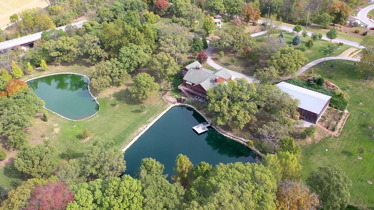 RARE 13 acre farm with custom home, 2 ponds, guest cottage, barn ...