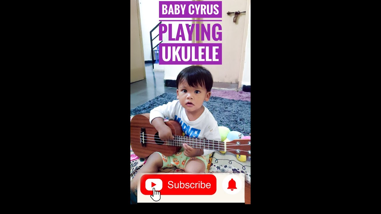 16th month old Baby plucking ukulele's strings|| Baby with ukulele ...