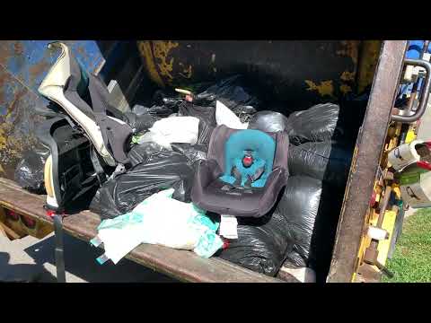 Rear load garbage truck packing bulk with some diapers - YouTube