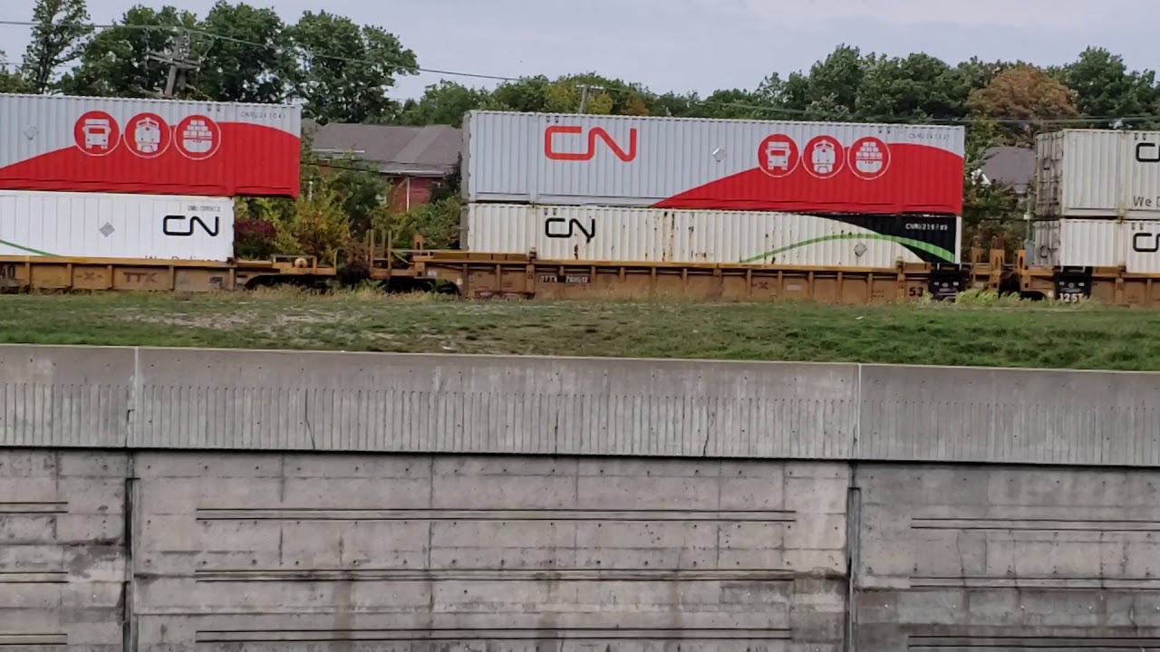 TRAINS 2 For 1 CN Intermodal Train Meets Via LRC at Beaurepaire - YouTube
