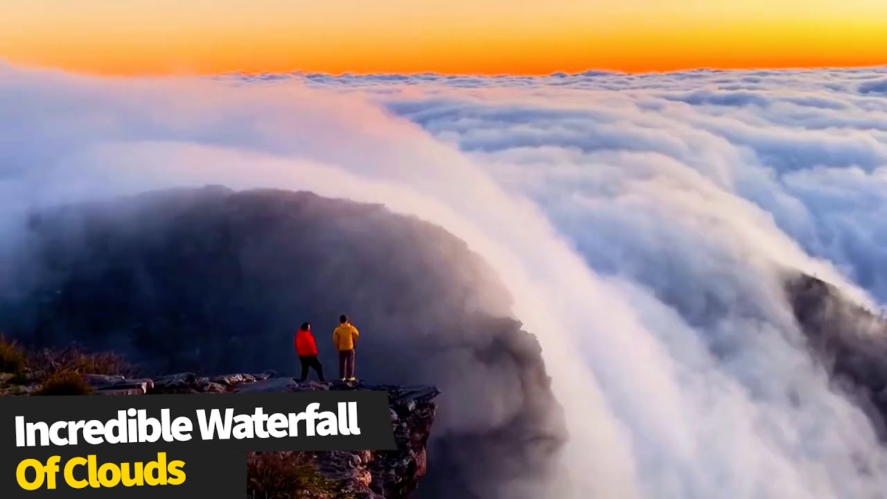 Breathtaking ethereal waterfall of clouds flows down mountainside - YouTube