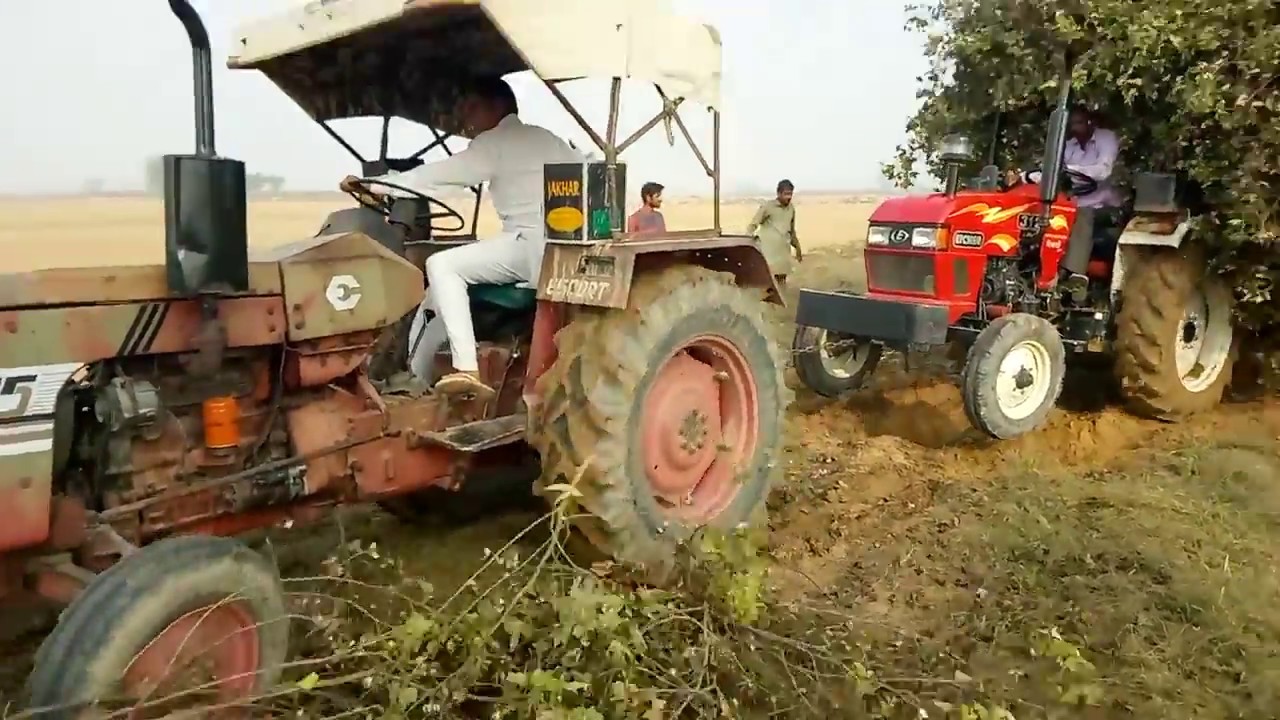 Eicher 312 vs escort 355 - YouTube