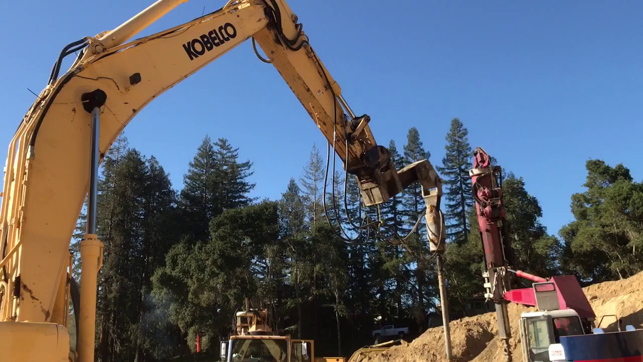 Drilling Residential Pier Foundation with Kobelco Dangle Drill - YouTube