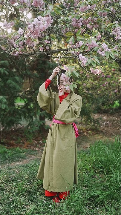 StockVideo - Woman Standing Under A Flowering Tree | non copyright ...