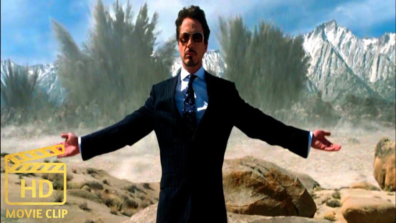 Iron Man ( Tony Stark ) is presenting his company's weapons to the army ...