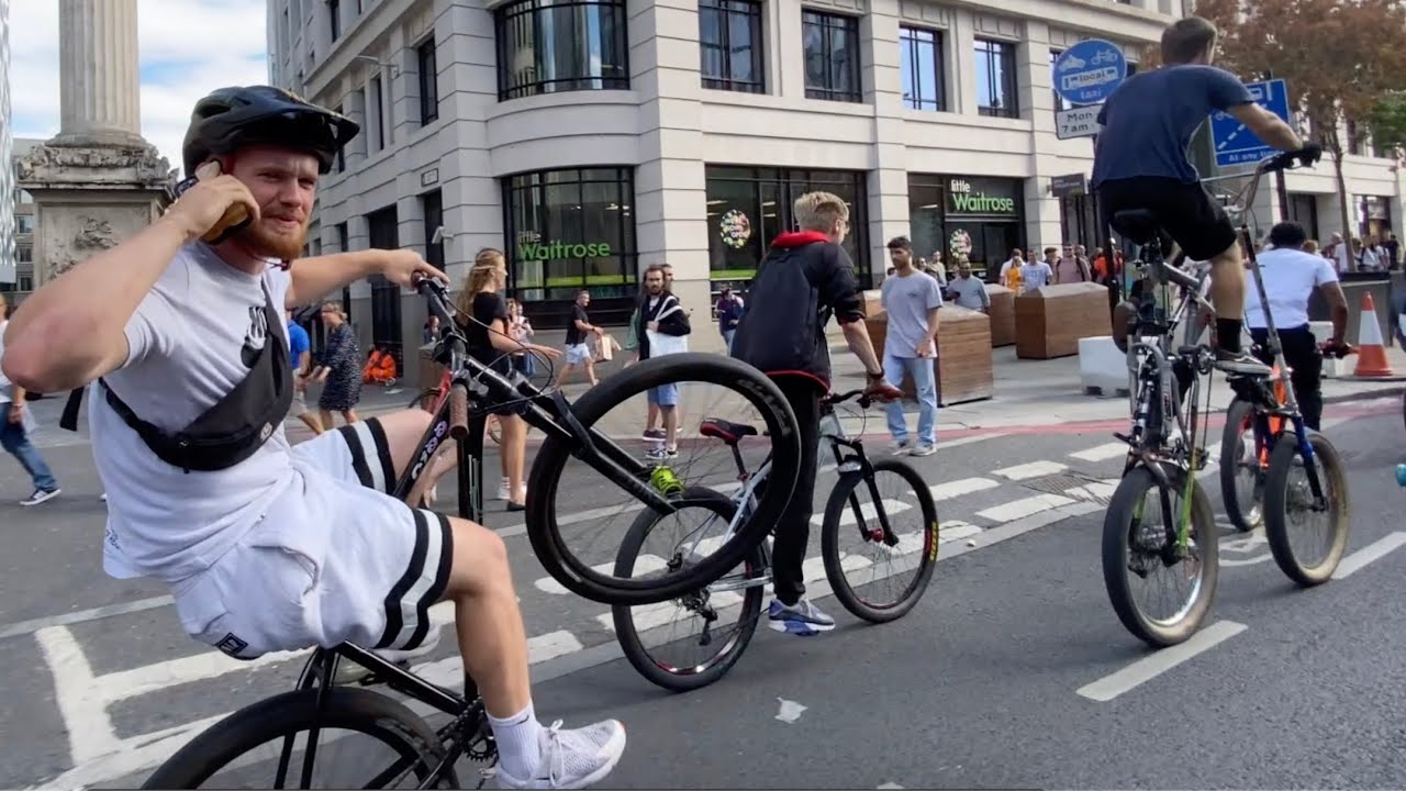 Guy Wheelies Worlds Tallest Bike Through City! - YouTube