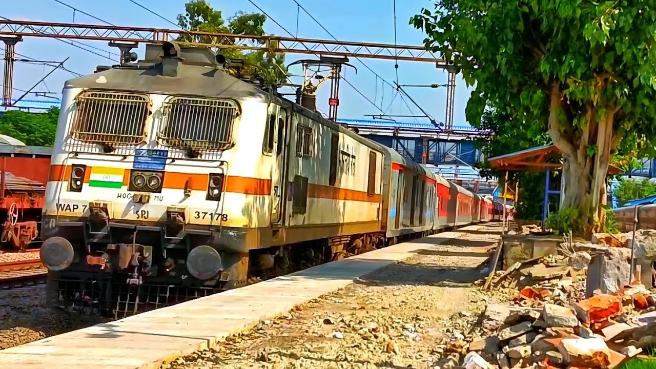 WAP 7 Locomotive red colour choches running on the track speed is 120 ...