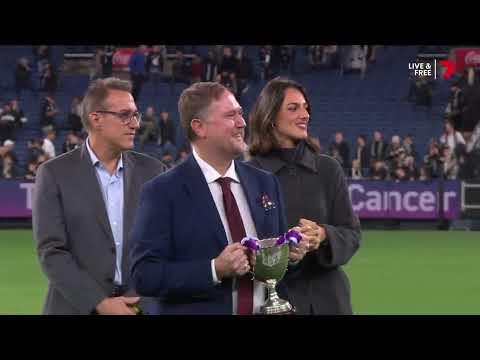 Professor Jason Payne presenting the 2026 Peter Mac Cup to Collingwood