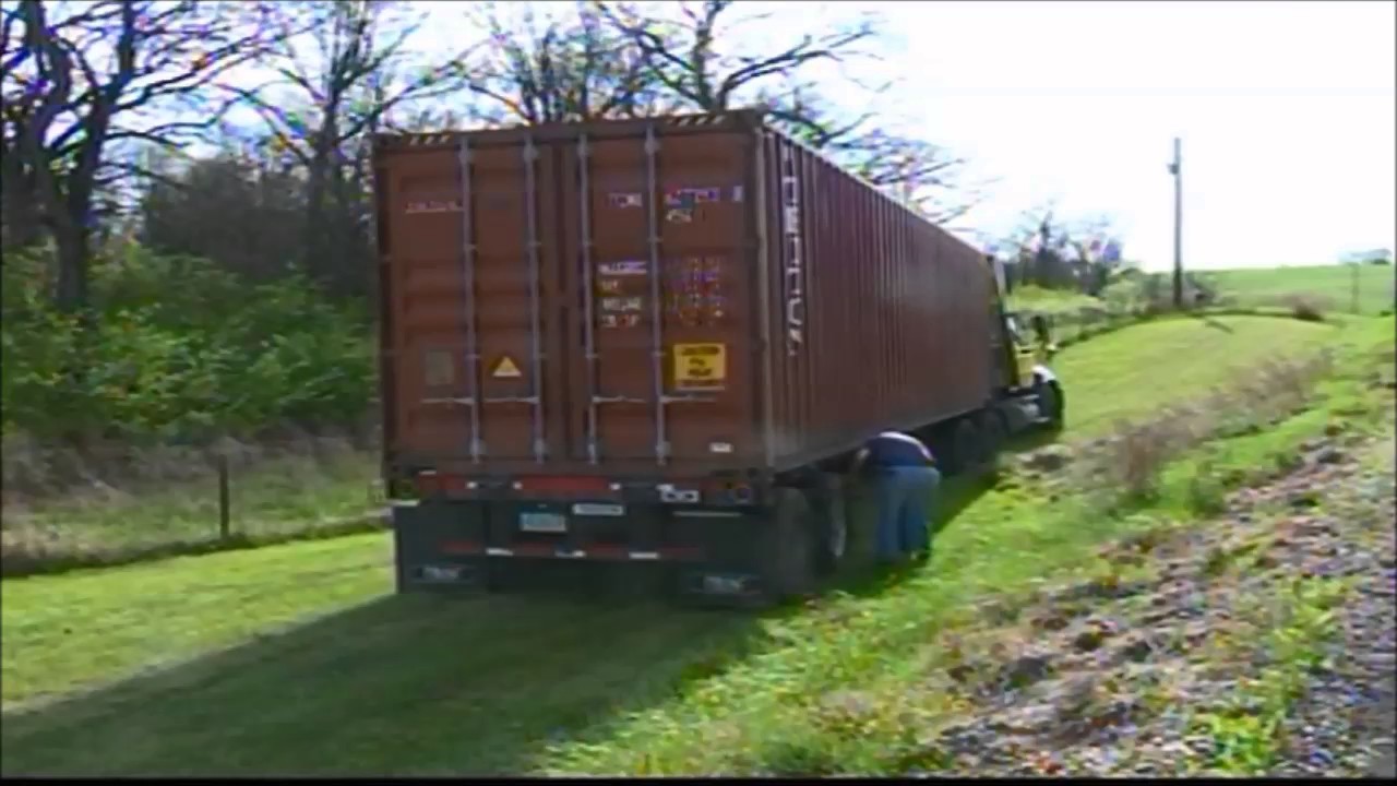 Semi runs off road into a ditch on Highway 156 - YouTube