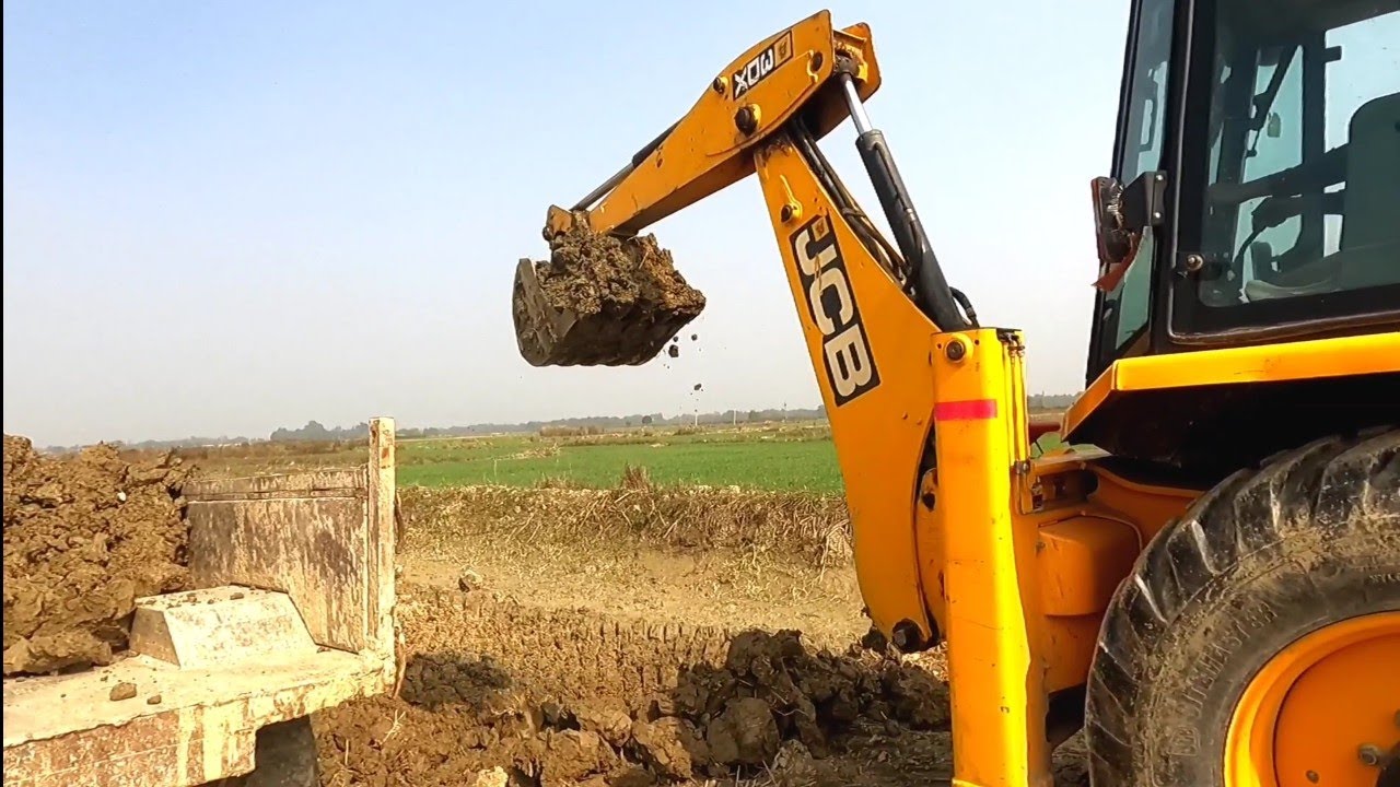 JCB video, JCB 3dx Ecco machine se tractor ki trolley me mitti loading - YouTube