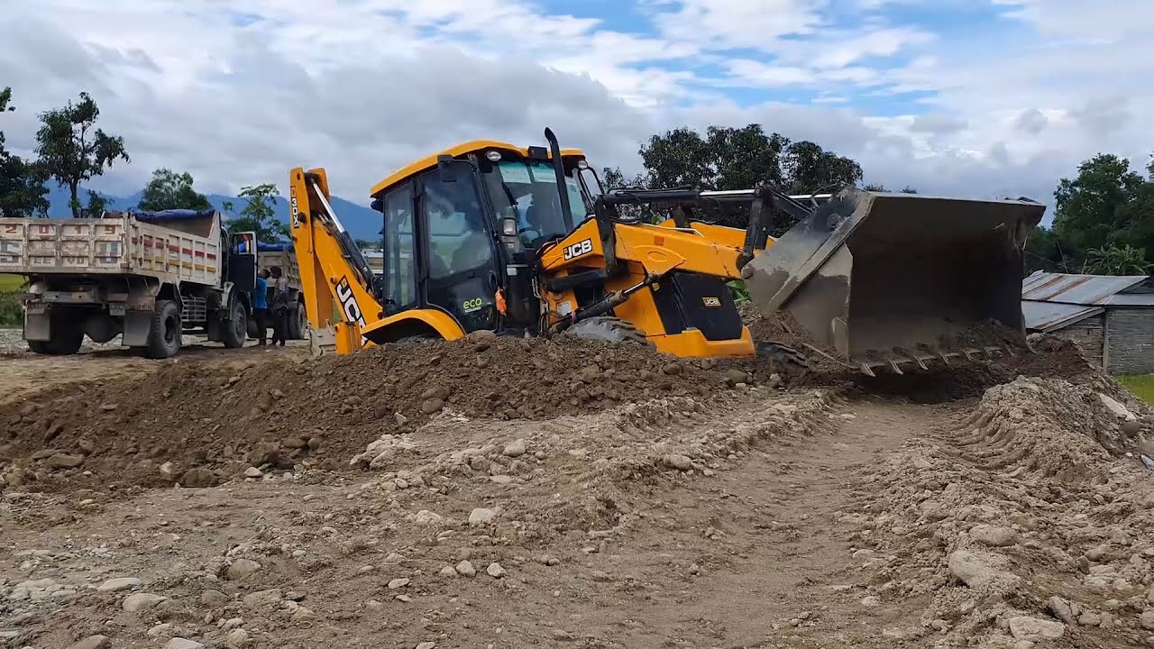 JCB Backhoe Loading Gravel in Dump Truck - Dump Truck Carrying Gravel ...