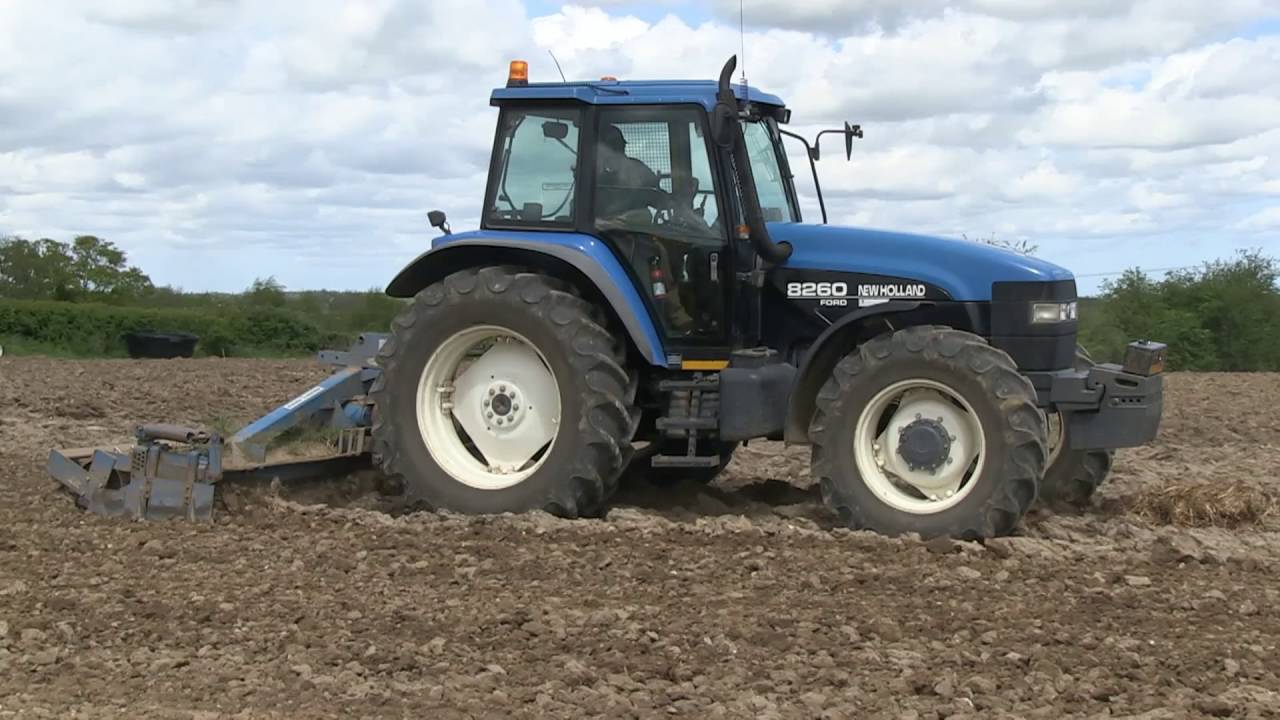 New Holland 8260 and Rabe power harrow - YouTube