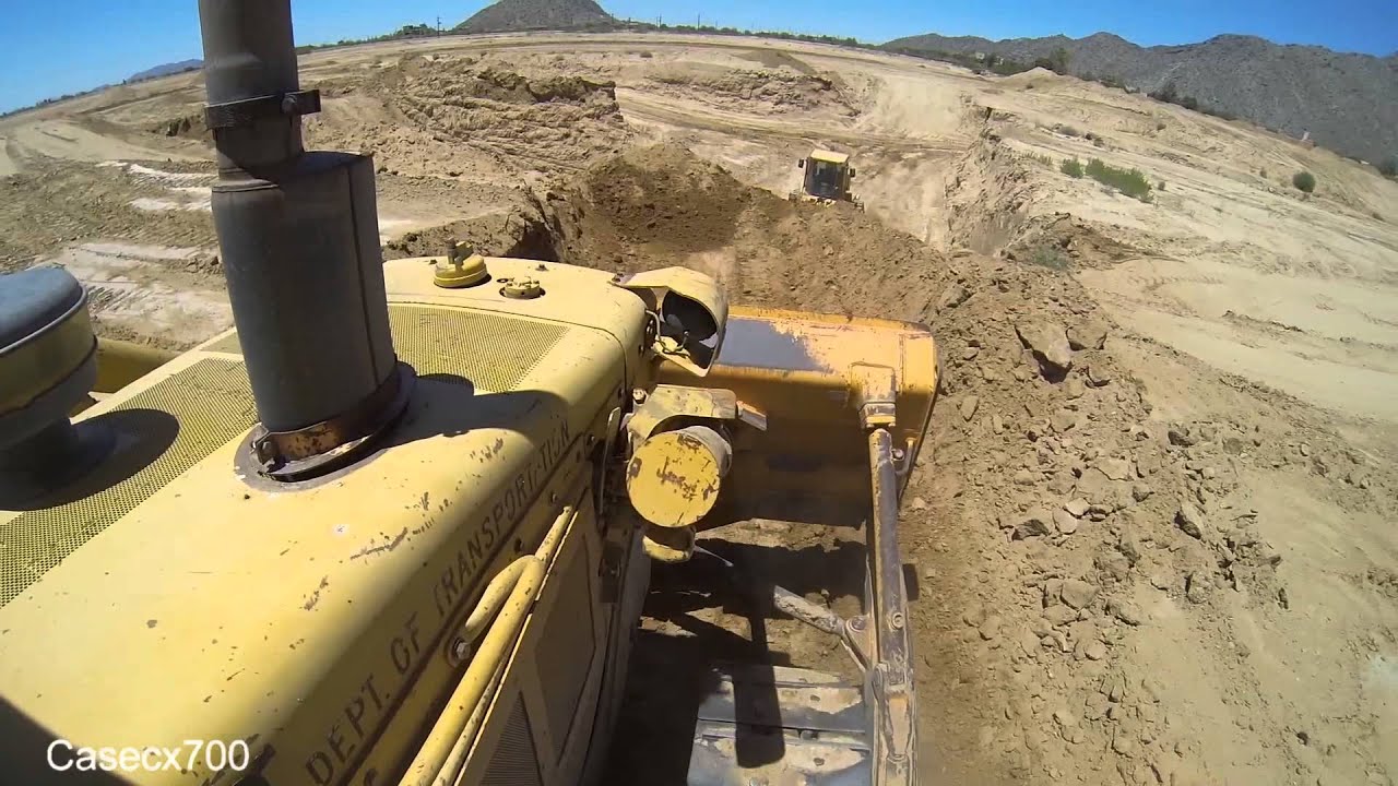 CAT D6D Dozer Pushing Dirt off a Cliff - YouTube