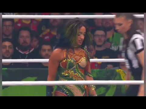 Mercedes Mone walks over people 