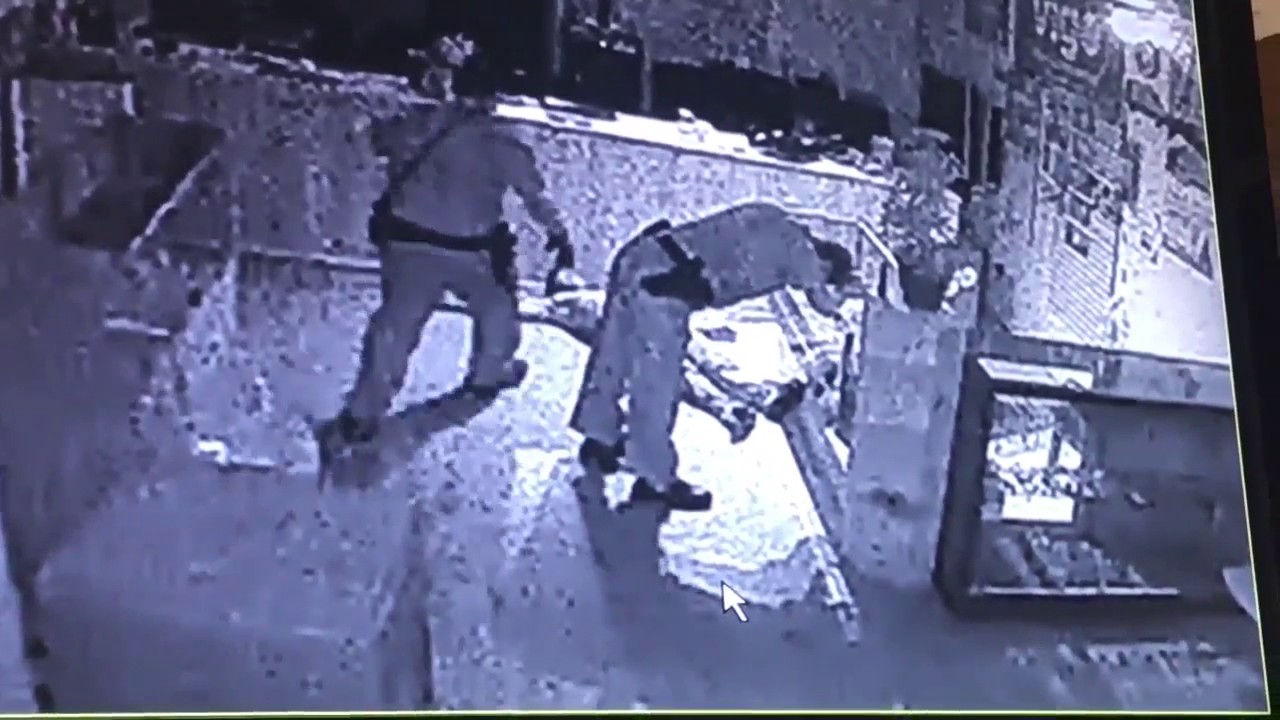 Surveillance video: Police officer fights for his life as burglar ...