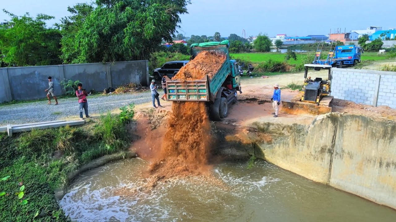 Unloading Heavy Loads: Dump Truck Discharging Massive Amounts of Soil ...
