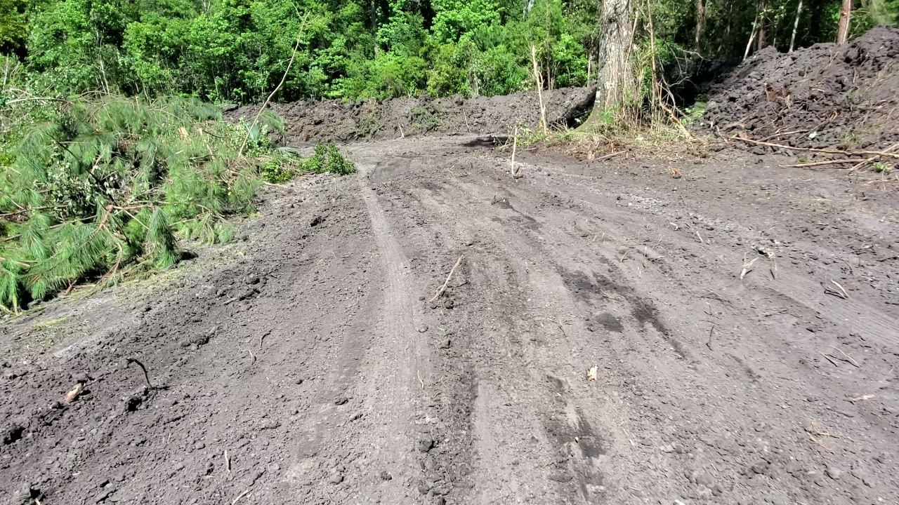 Making berms and grading with the tractor! - YouTube