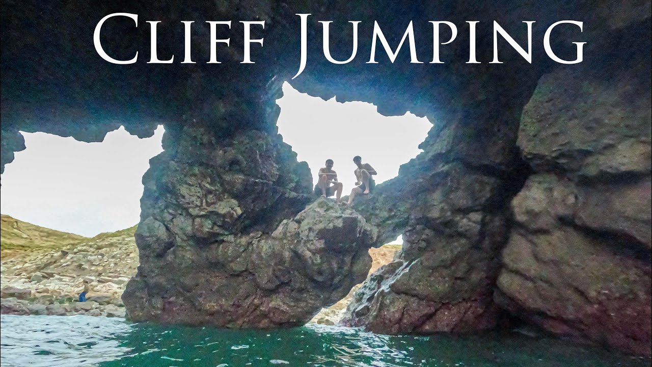 FREEZING CLIFF JUMP IN SEA CAVE - YouTube