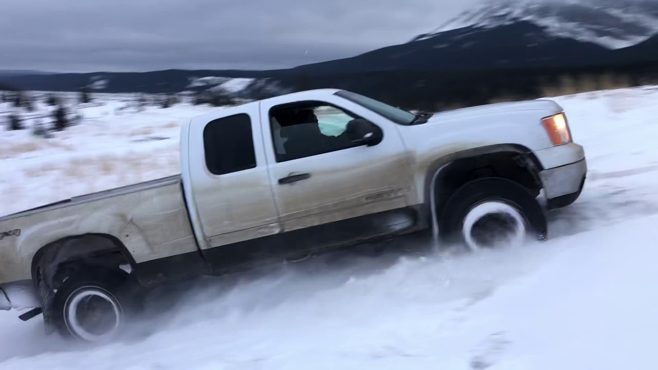 GMC Sierra snowy hill climb in waiparous - YouTube