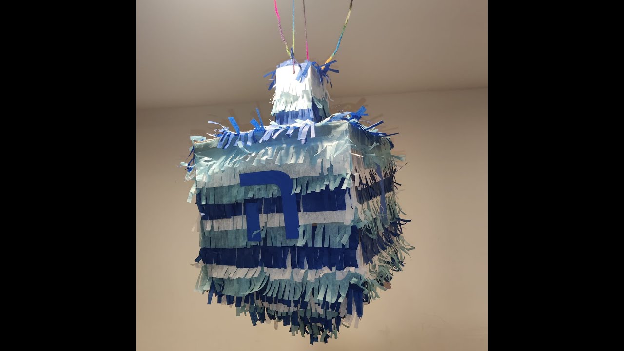 Watch the creation of our EPIC dreidel pinata out of cardboard, tape ...