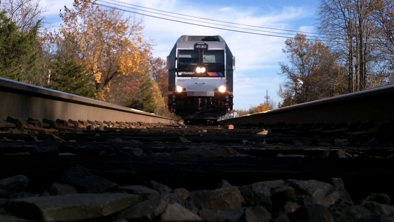 NJ Transit Trains Going Over RailRoad Crossing - YouTube