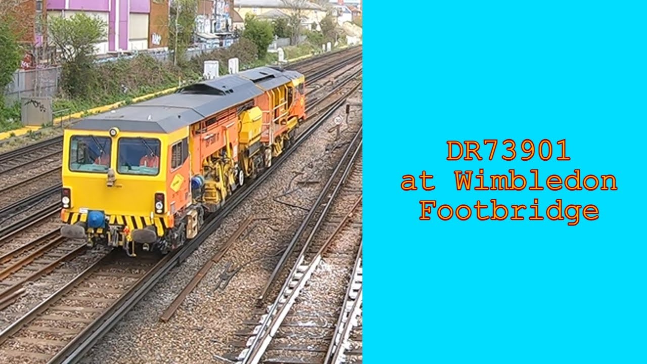 MEGA TONES! Colas Rail Tamper DR73901 passes Wimbledon Footbridge ...