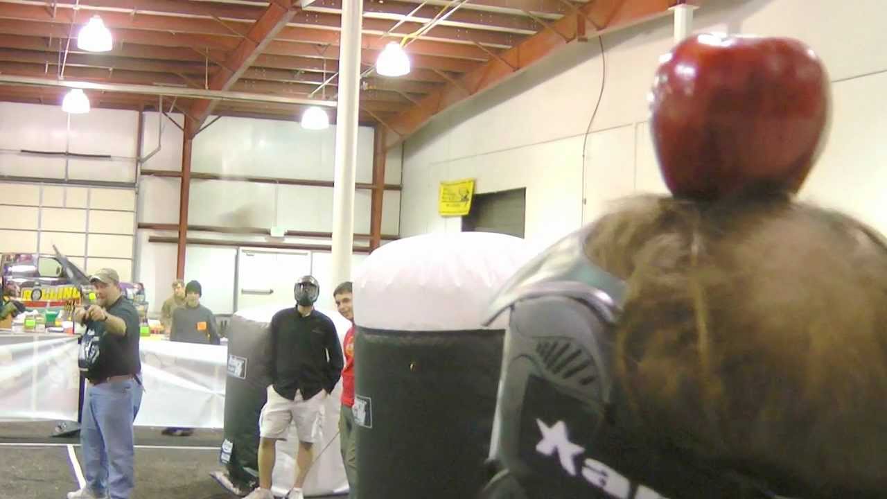 Shooting apples off of people's heads with a bow and arrow - YouTube