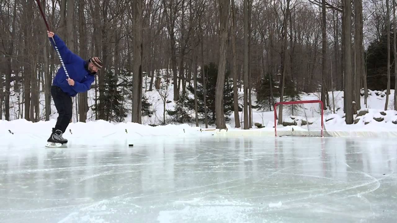 Backyard Icerink Slapshot Slo-mo - YouTube
