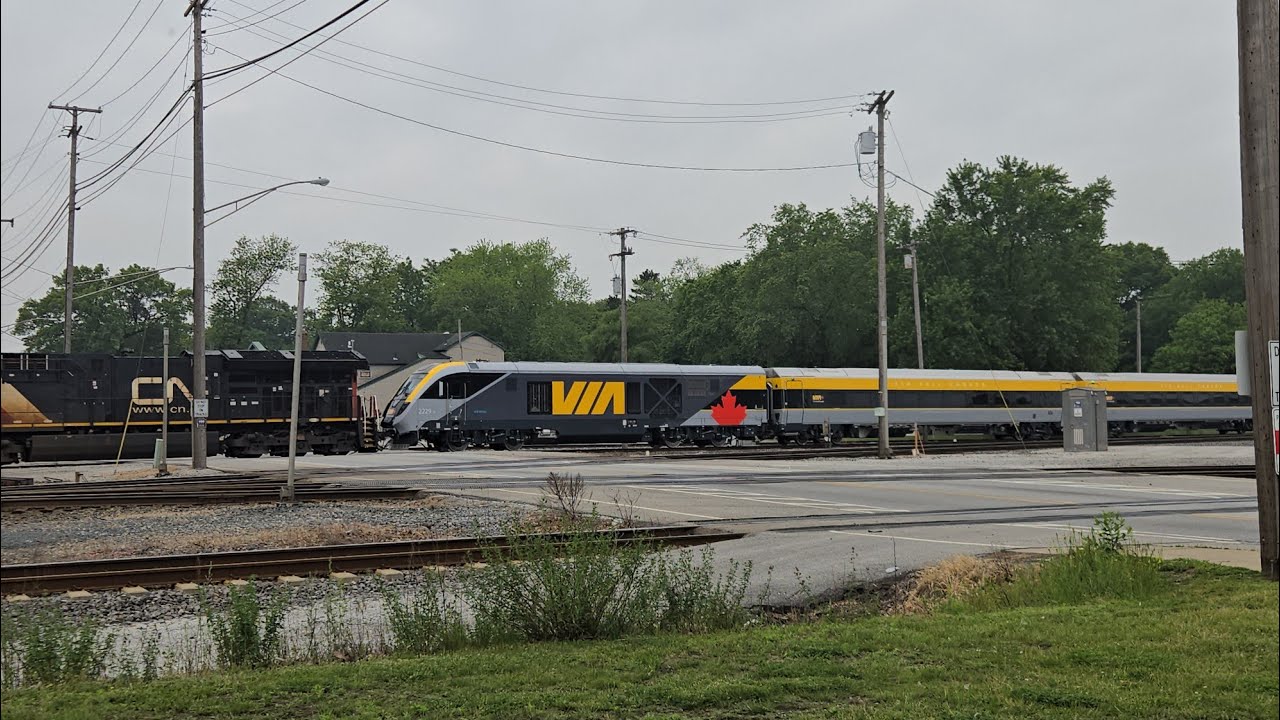 CN #3245 leads a Via Rail/Exo Charger Delivery Train through Griffith ...
