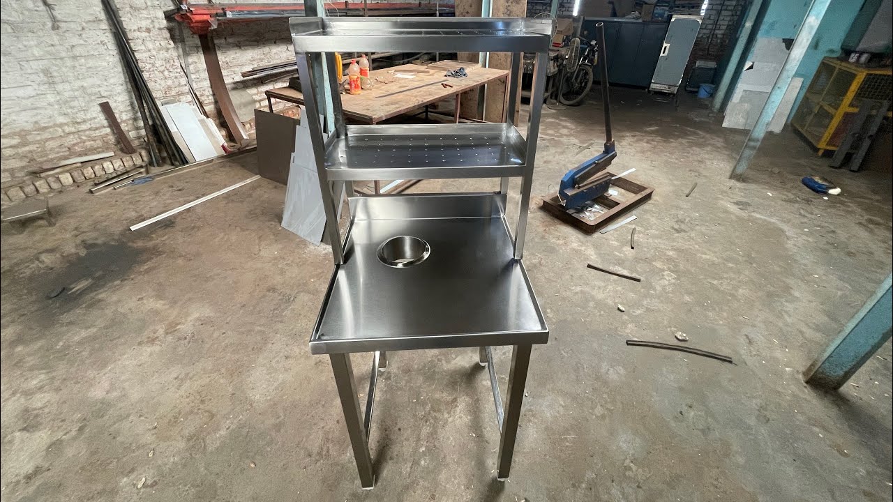 Dirty dish landing table with garbage chute and two perforated over ...