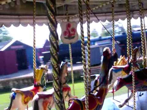 carousel ride in almost deserted park with organ playing - YouTube