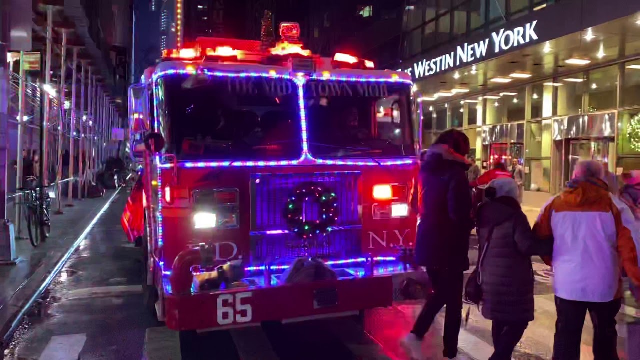 FDNY ENGINE 65, SPORTING IT’S CHRISTMAS LIGHTS, WHILE ON SCENE OF A 10 ...