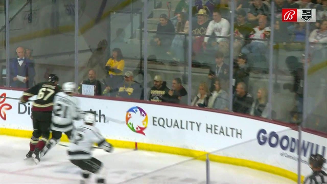 Lawson Crouse drops the shoulder on Jordan Spence sending him into the ...