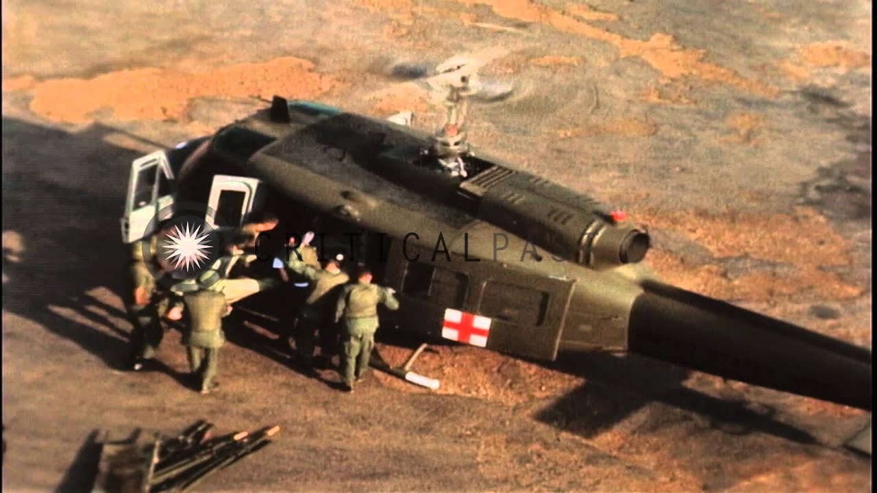 Wounded man on stretcher moved in MEDEVAC (Medical evacuation ...