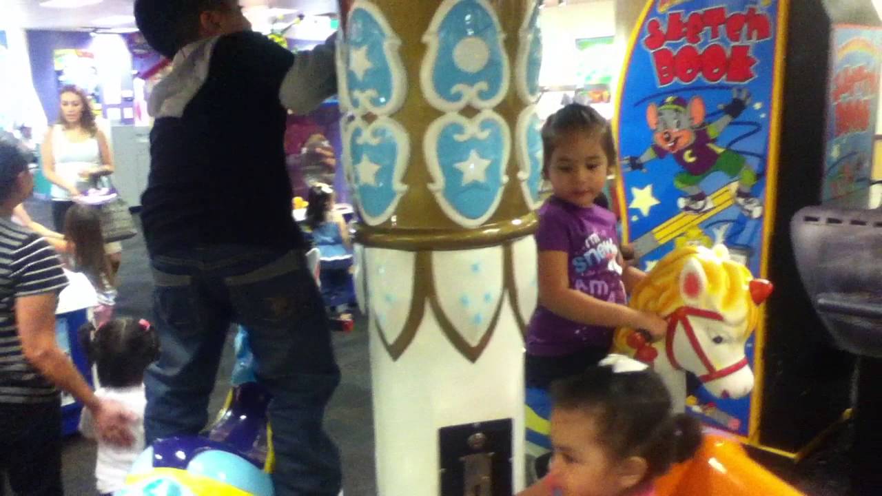 Our babies on the Carousel at Chuck E. Cheese - YouTube