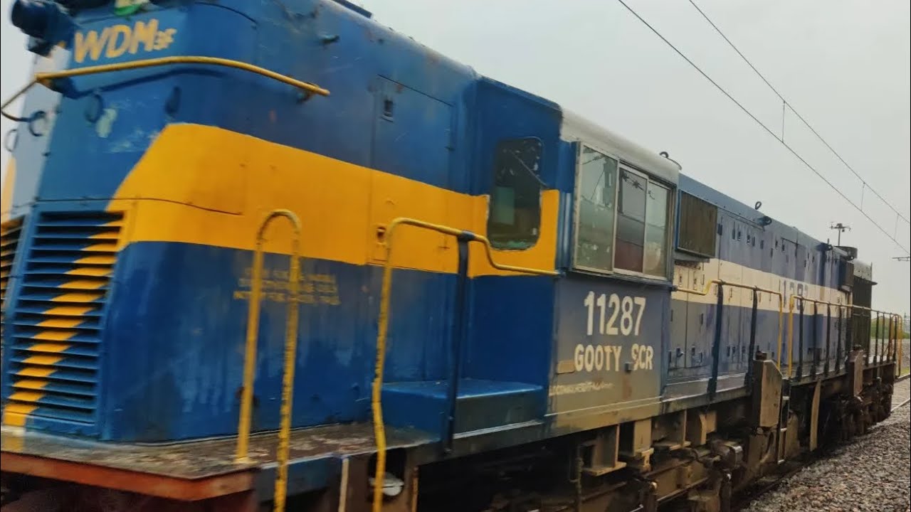 SAPPHIRE BLUE/YELLOW/WHITE SHUNTER ENGINE SHUNTS COAL TRAIN AT YARD ...