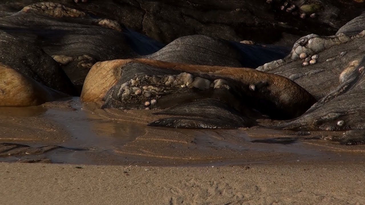 Relax - Rocks with unusual shapes by the sea on the beach - YouTube
