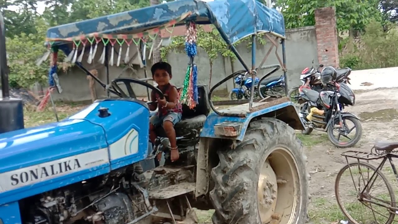 Child try to drive tractor - YouTube