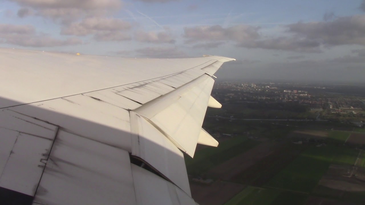 KLM B777-300ER Wing view departure from Amsterdam and sunset over USA ...