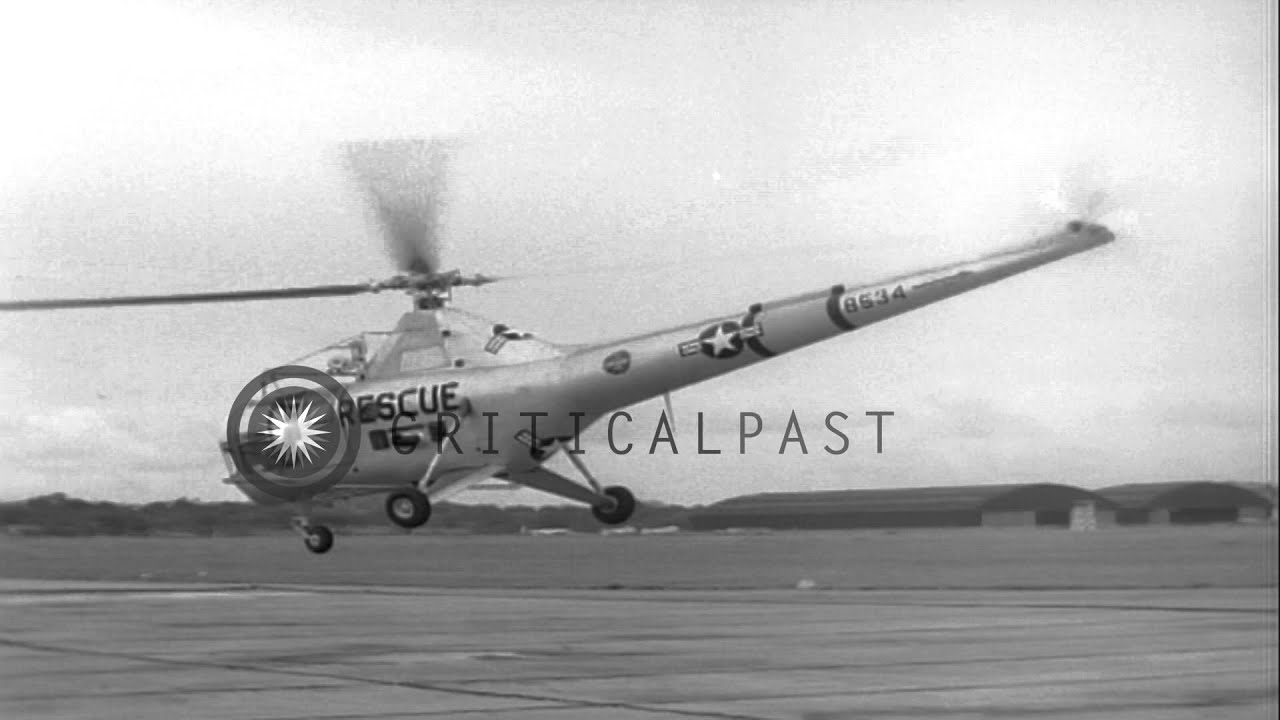 A United States Air Rescue Sikorsky H-5 helicopter lifts off and lands ...