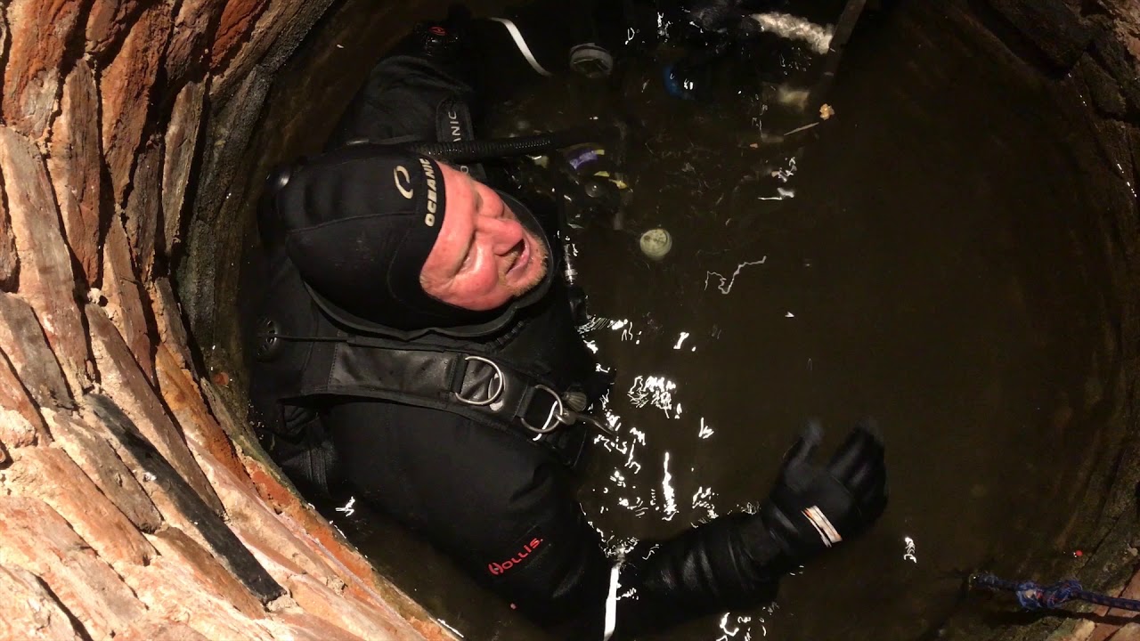 Scuba diver digs for treasure in Suffolk pub's wishing well - YouTube